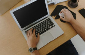 Man using 15 inch MacBook Pro mockup | MockupsJar